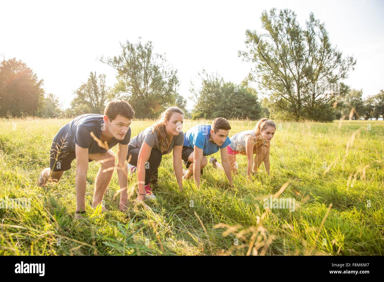 Group running in field hi-res stock photography and images - Alamy