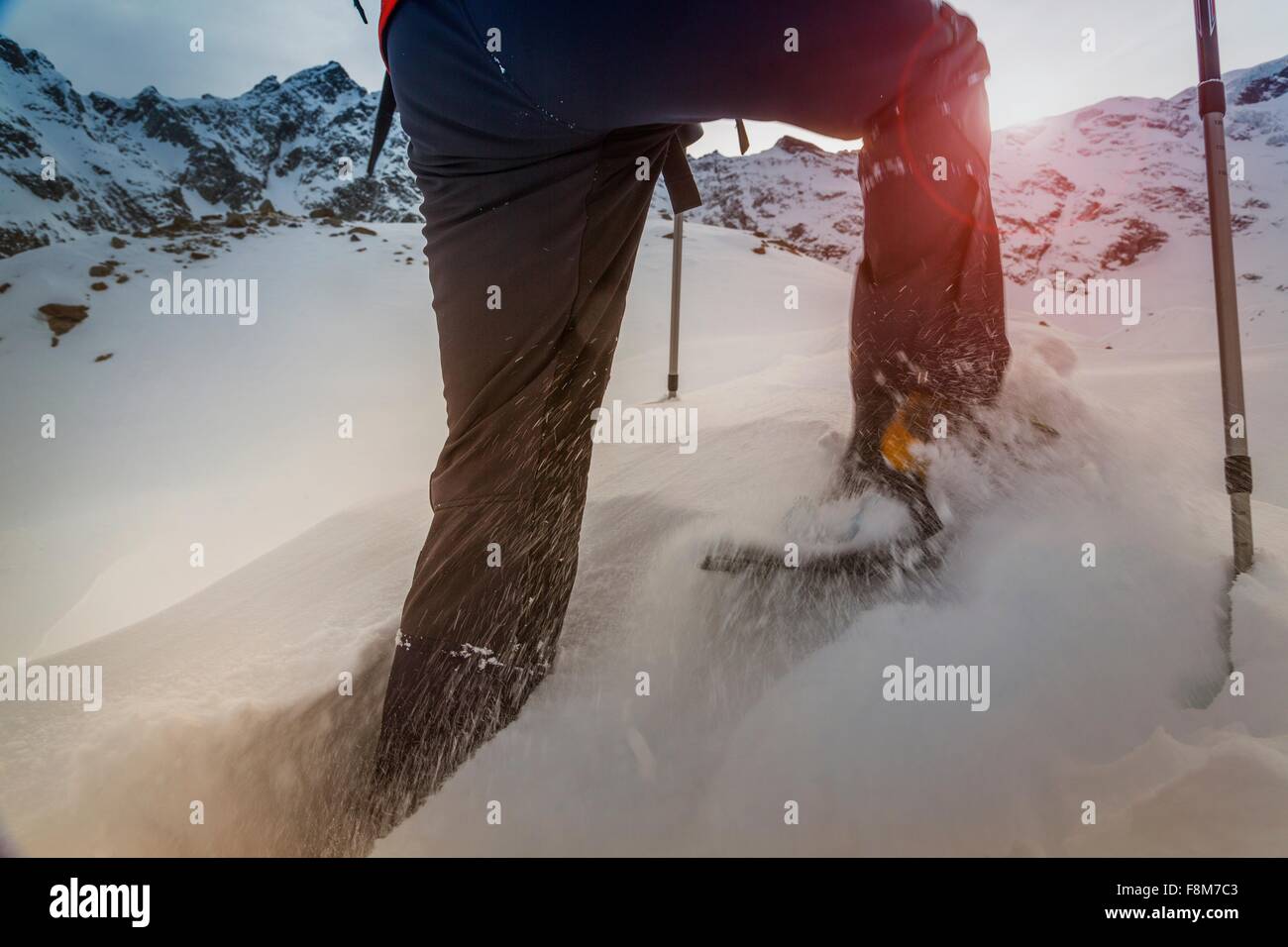 Climber wearing snow shoes walking through deep snow, Monte Rosa ...