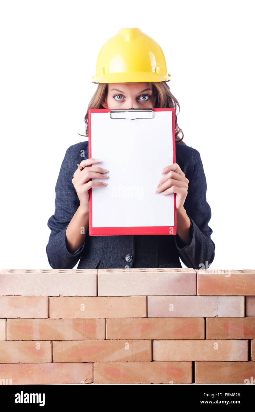 Woman builder and brick wall Stock Photo - Alamy