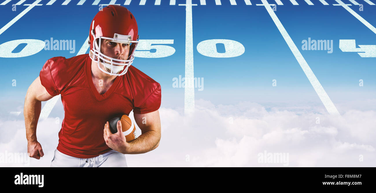 Football player running the ball hi-res stock photography and images ...