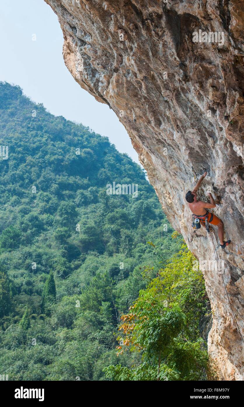 Male climber climbing at Odin's Den next to Moon Hill in Yangshuo ...