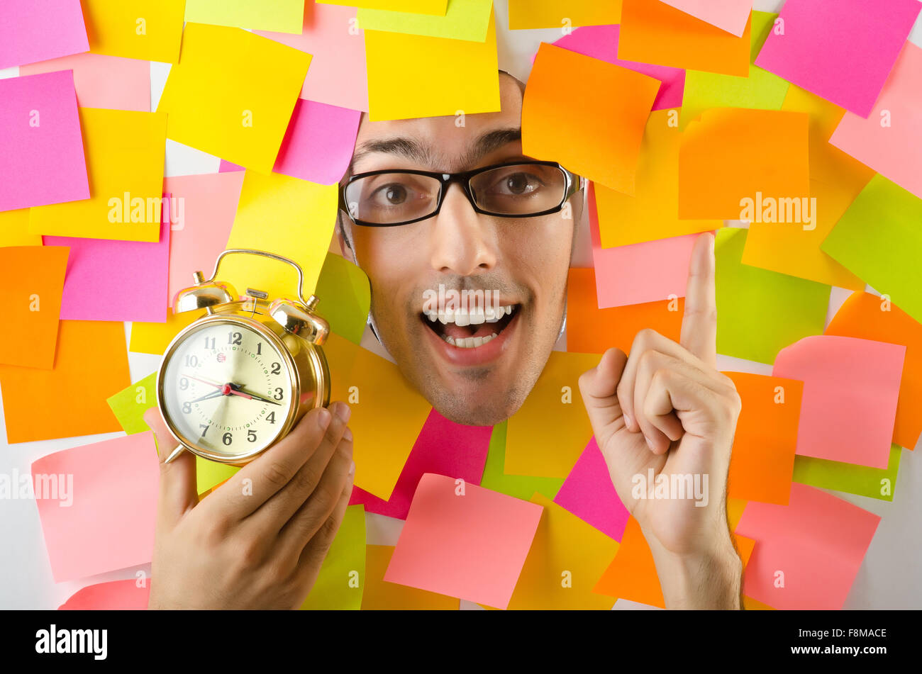 Man's face through paper and reminders Stock Photo - Alamy