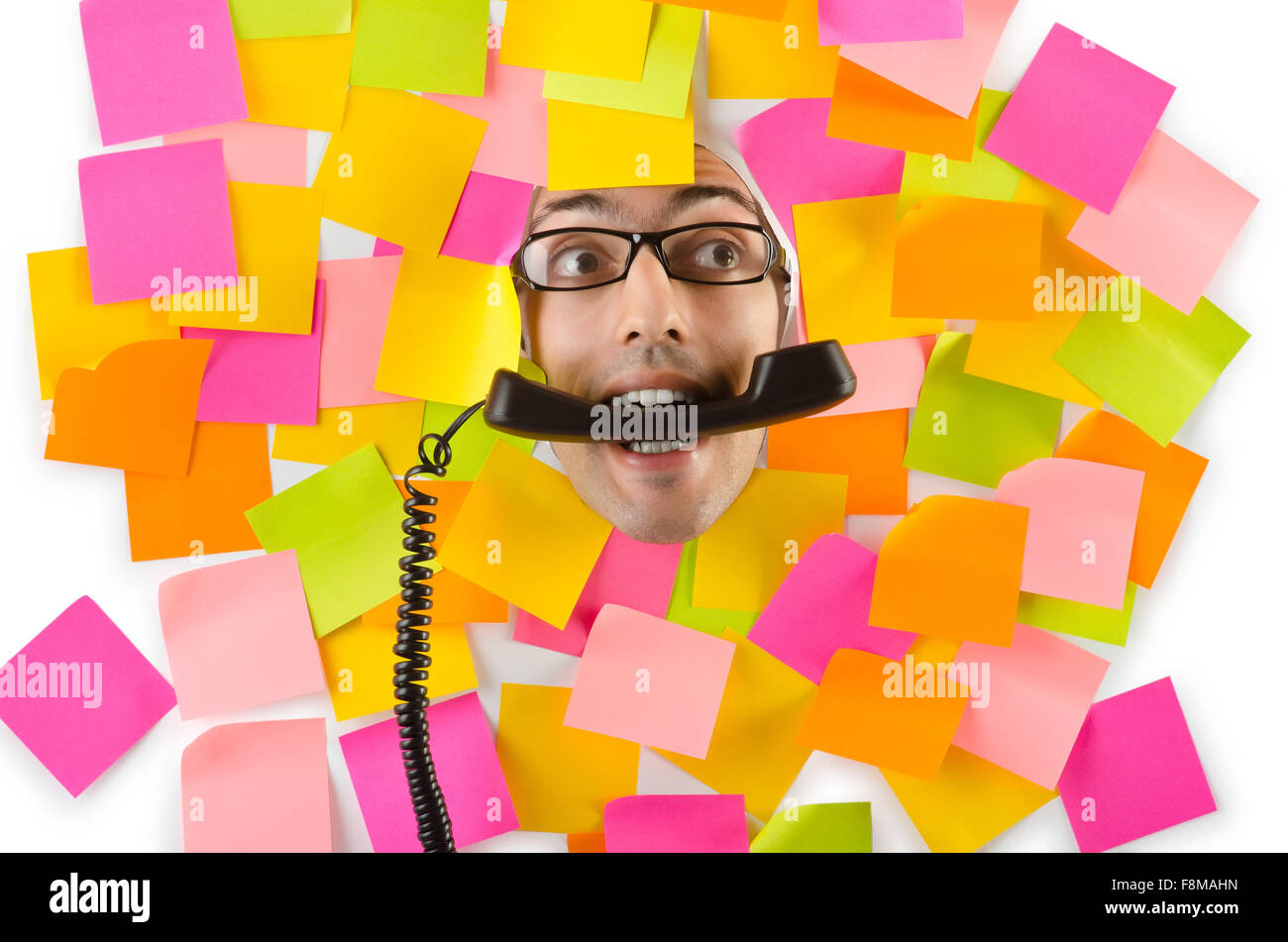 Man's face through paper and reminders Stock Photo - Alamy