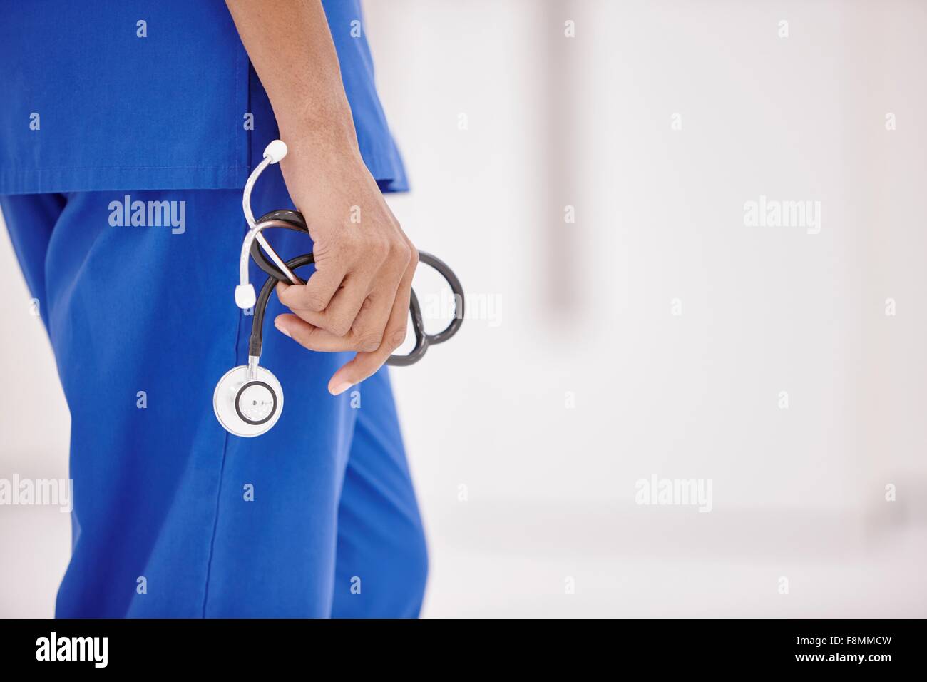 Doctor wearing scrubs stethoscope hi-res stock photography and images ...