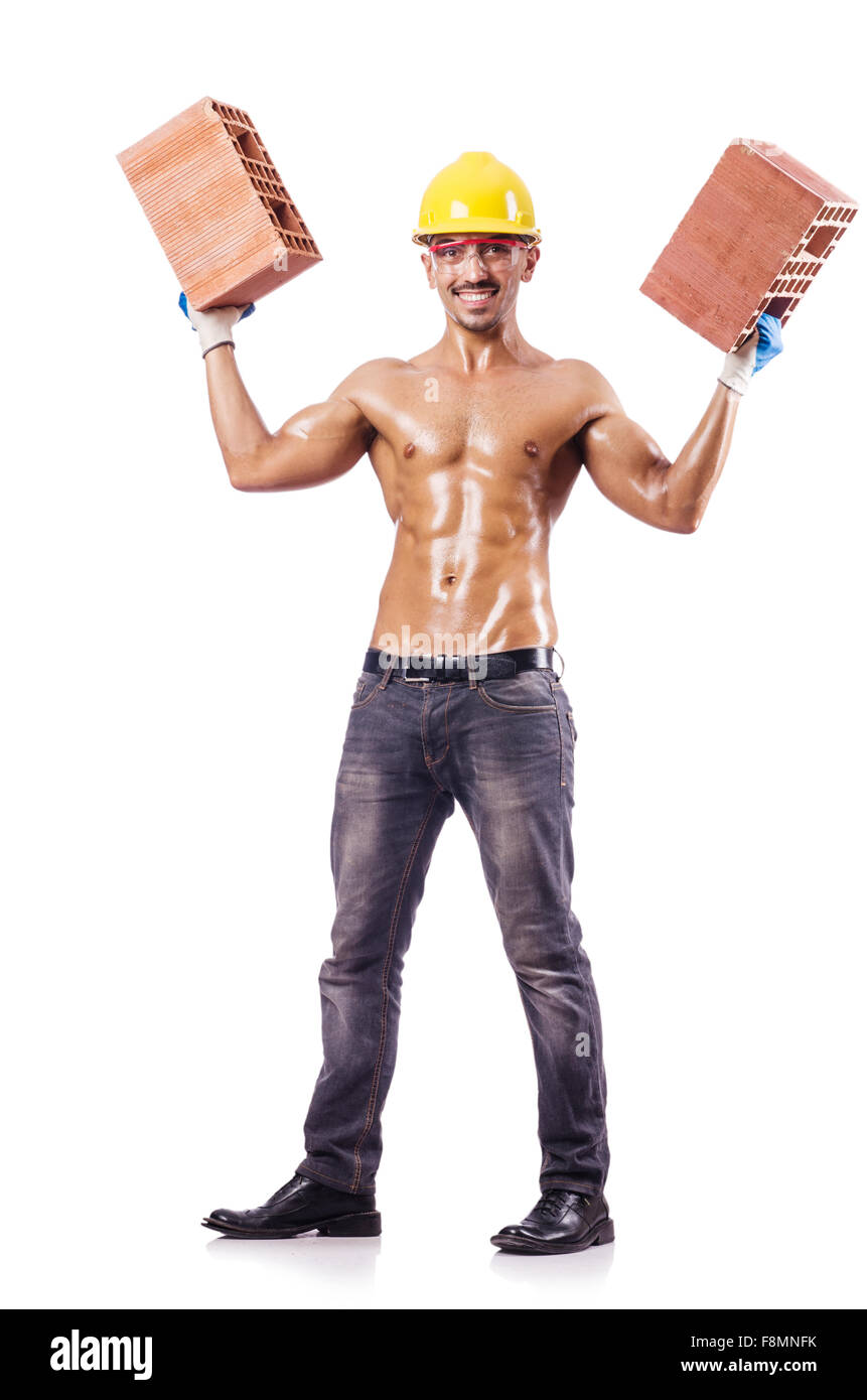 Muscular builder with bricks on white Stock Photo - Alamy