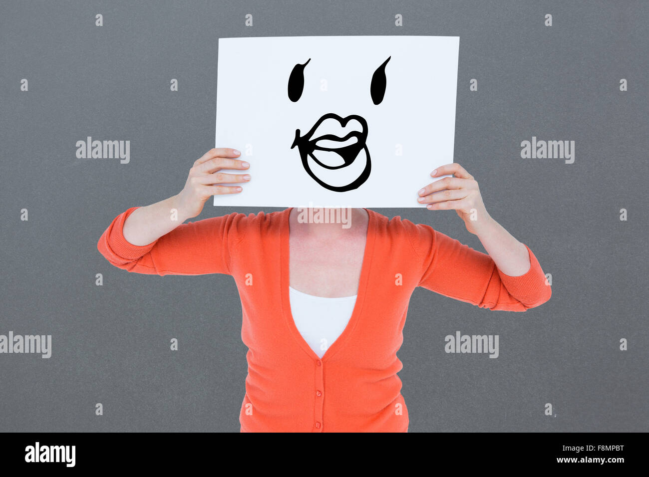 Composite image of woman holdinh blank billboard in front of face Stock ...