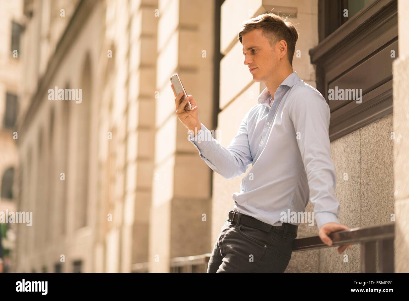 Man using phone, London, UK Stock Photo - Alamy