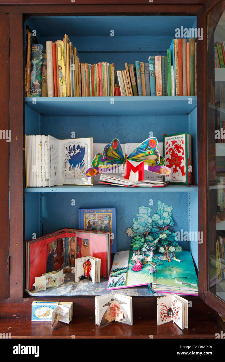 Collection of pop-up books on bookcase Stock Photo - Alamy