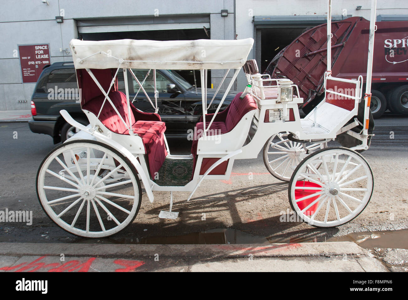 A side view of a empty carriage used for city tours in Midtown ...