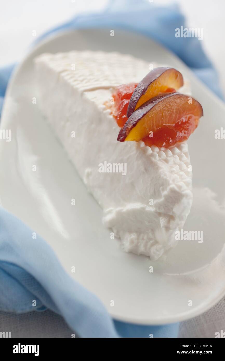 Cream cheese with sliced plums Stock Photo - Alamy