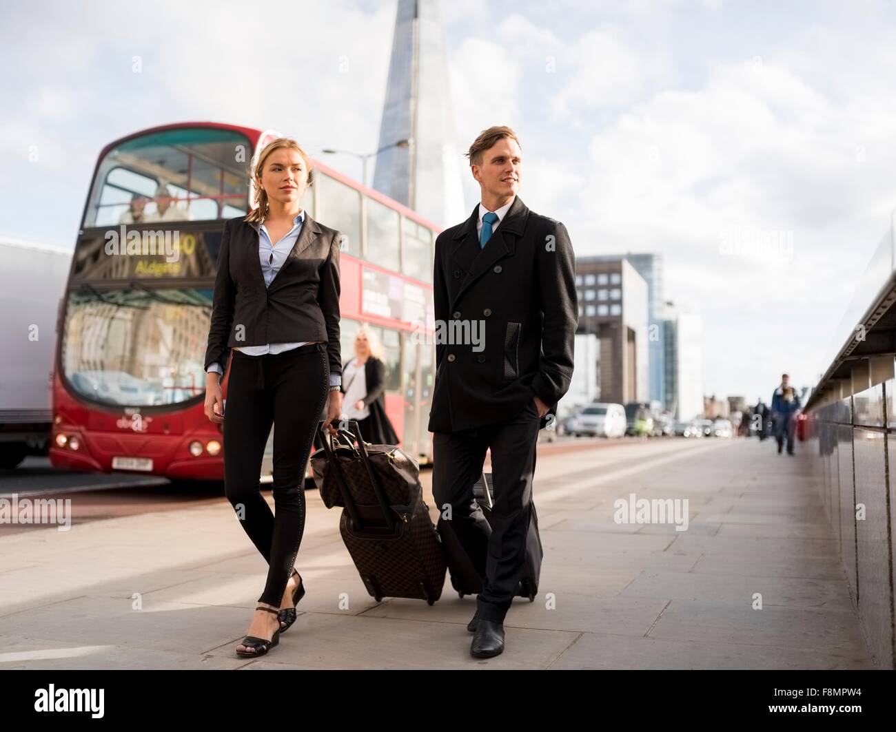 Businessman and businesswoman on business trip, London, UK Stock Photo ...
