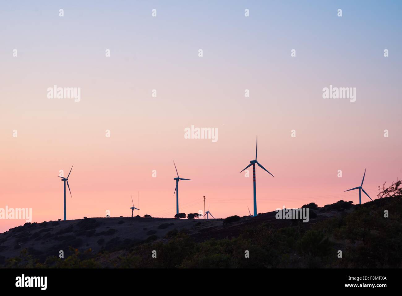 Wind turbine against setting hi-res stock photography and images - Alamy