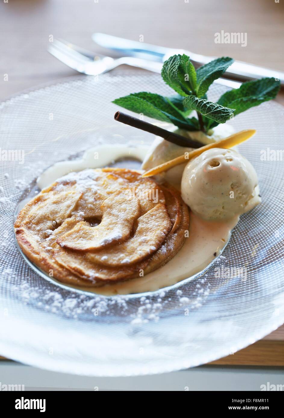 Apple beignets with cinnamon ice cream and mint Stock Photo - Alamy