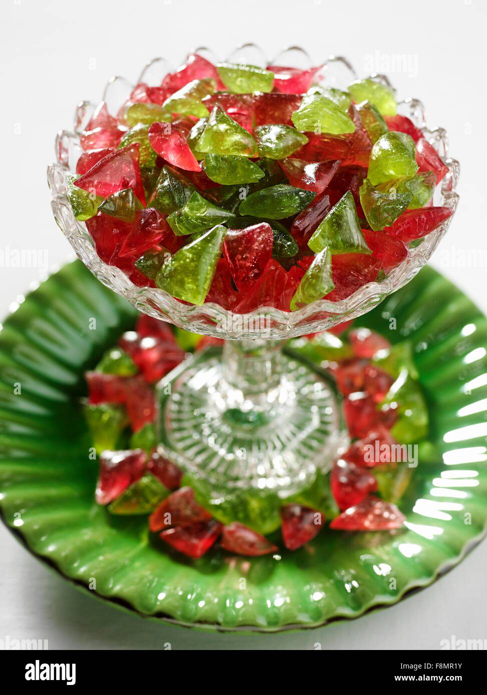 Red and green sweets in a glass bowl Stock Photo - Alamy