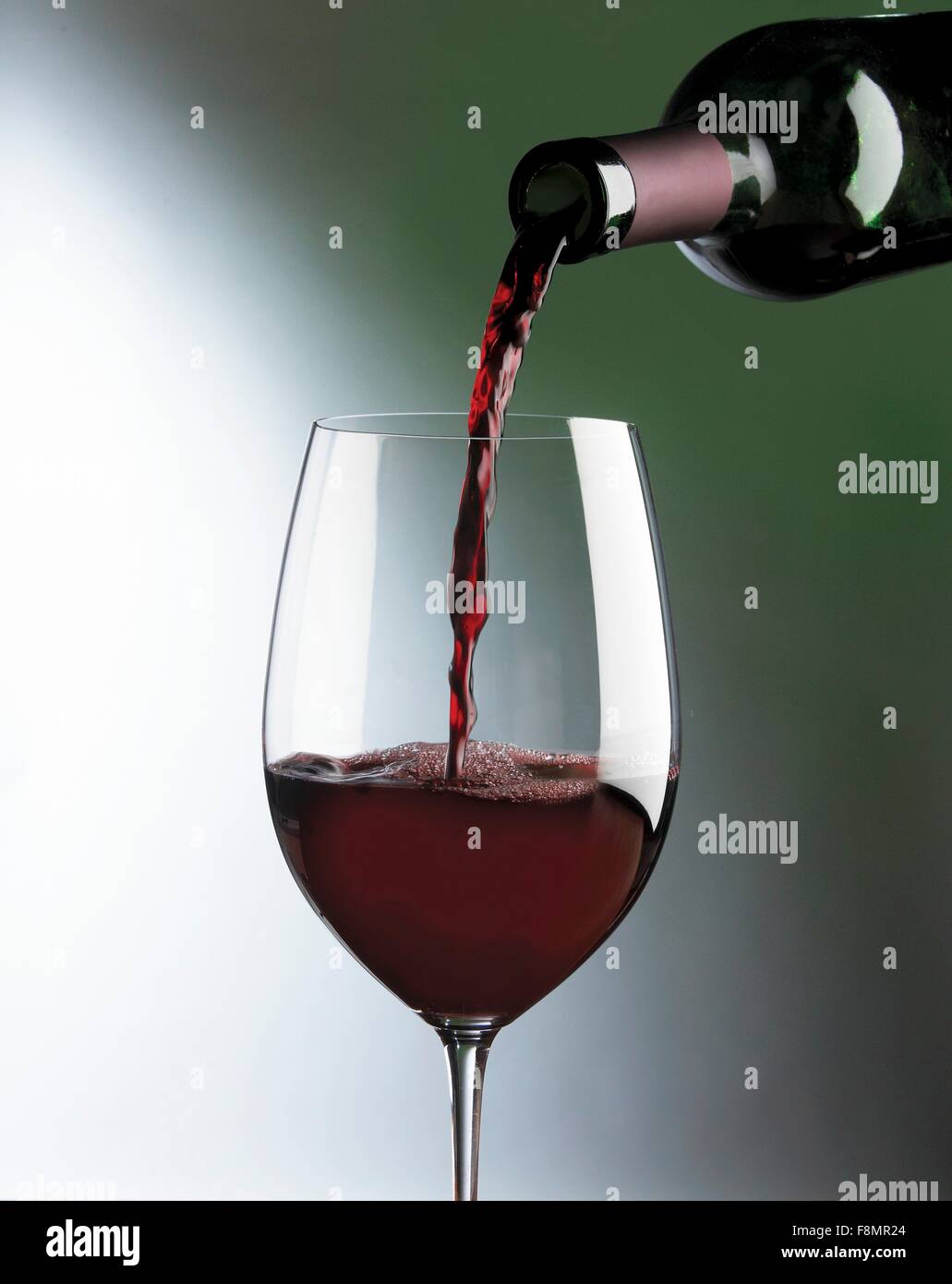 Pouring red wine Stock Photo - Alamy