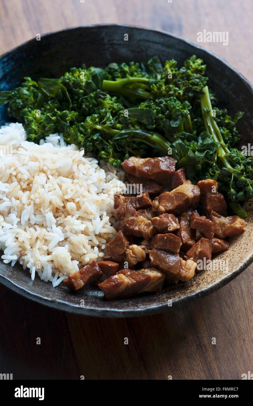 Thit kho trung (caramelised pork, Vietnam) with rice and broccoli Stock ...