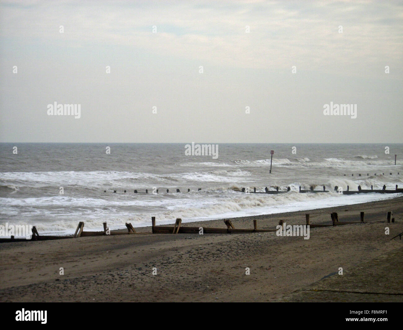 Beach, breakwaters and sea Stock Photo - Alamy