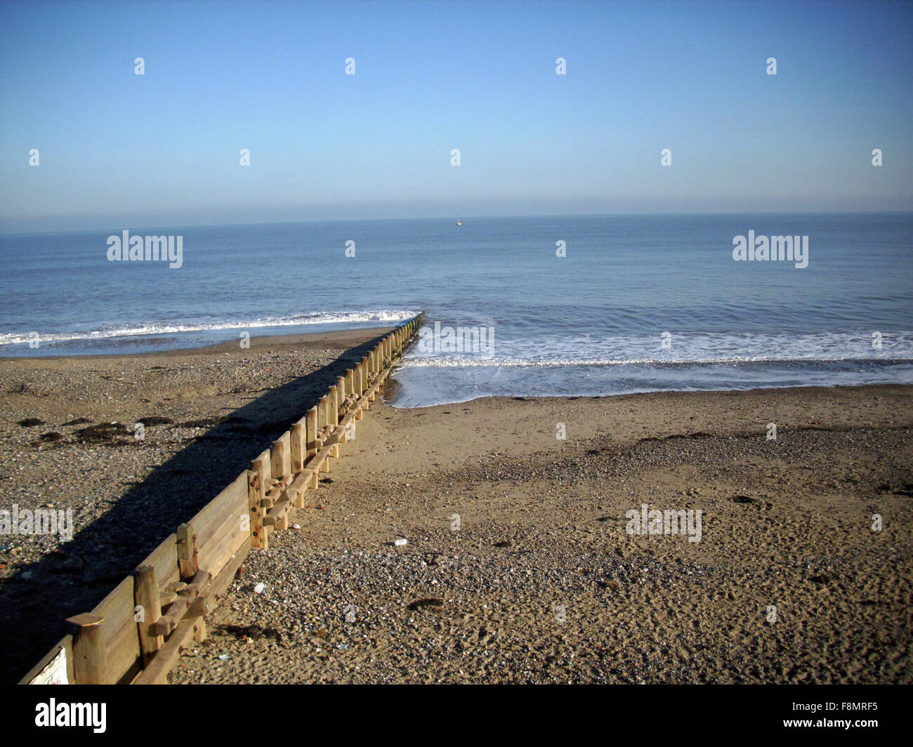 Beach, breakwater and sea Stock Photo - Alamy