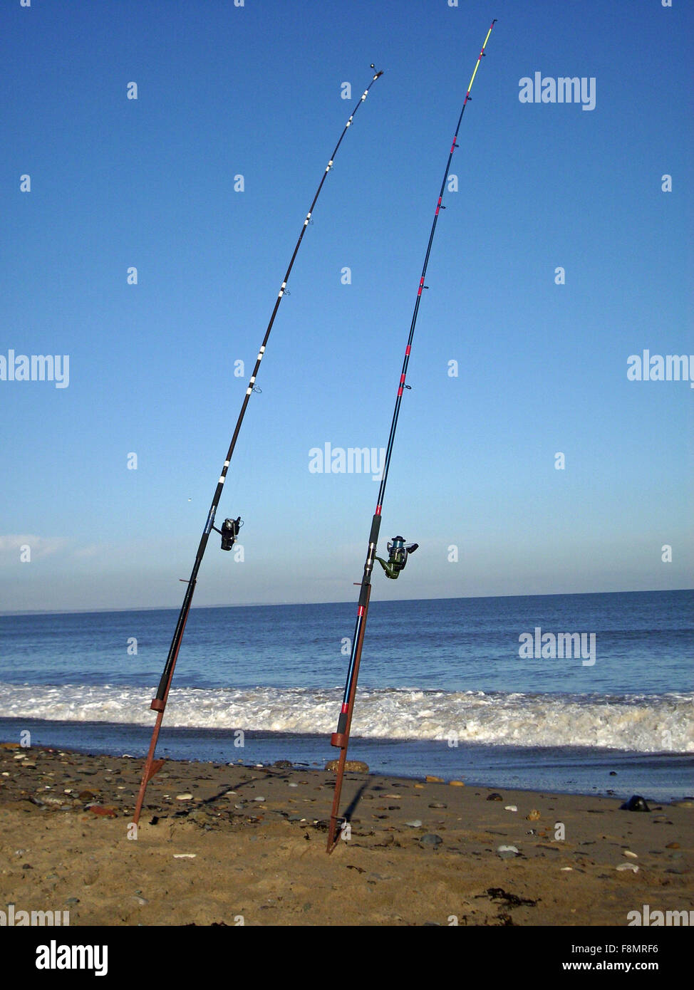 Sea fishing rods on beach Stock Photo - Alamy