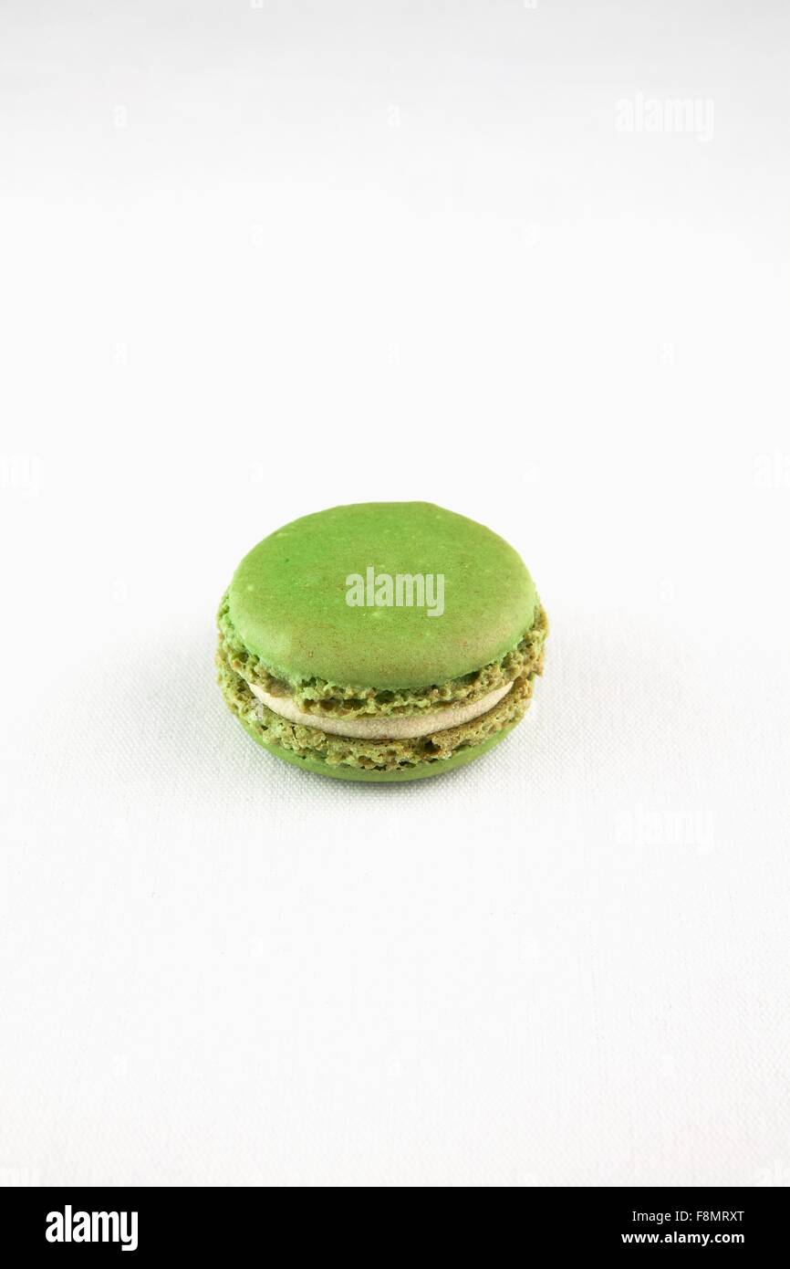 A Single Pistachio Macaroon on a White Background Stock Photo - Alamy