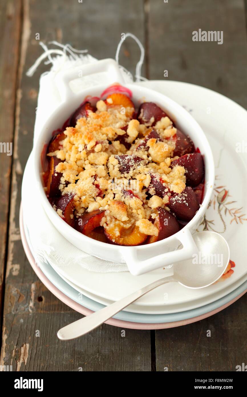 Plum Crumble in Individual Baking Dish; Spoon Stock Photo - Alamy