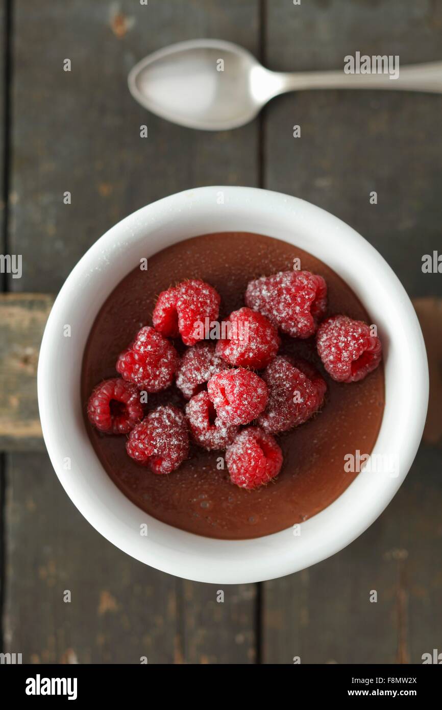 Chocolate pudding topped with raspberries (view from above Stock Photo ...