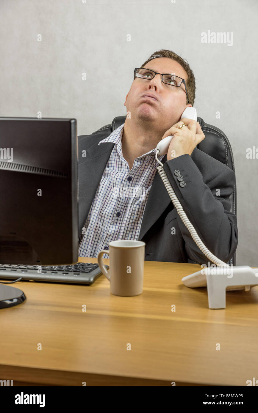 A man working at his computer in the office Stock Photo - Alamy