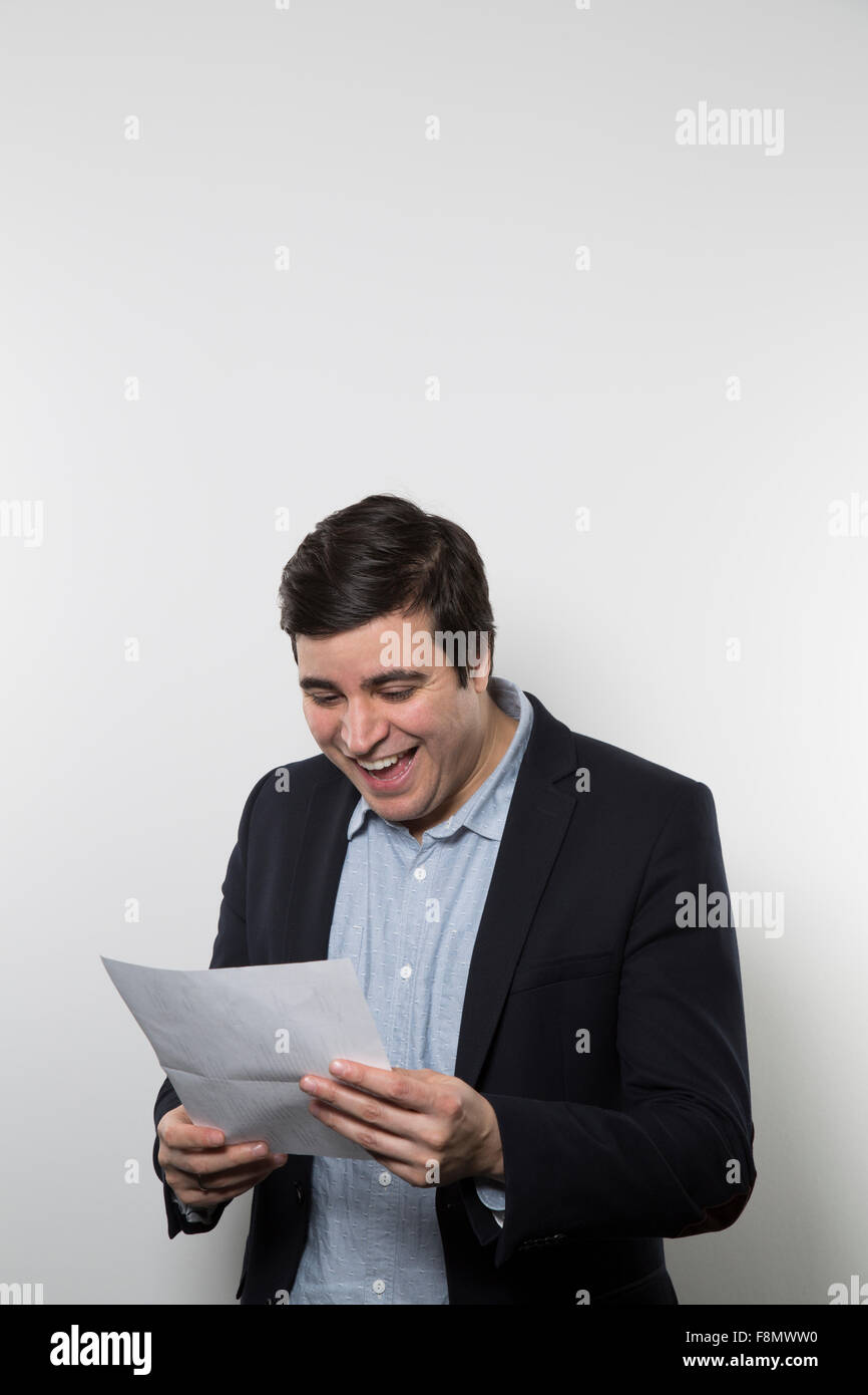 Man holding piece of paper hi-res stock photography and images - Alamy