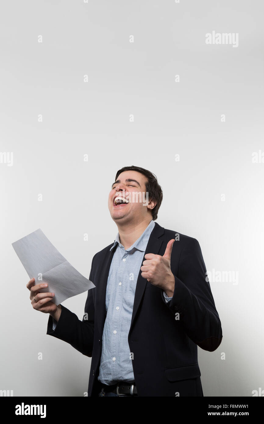 Man holding piece of paper hi-res stock photography and images - Alamy