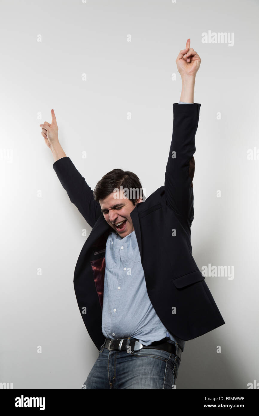 Guy with arms up business suit hi-res stock photography and images - Alamy