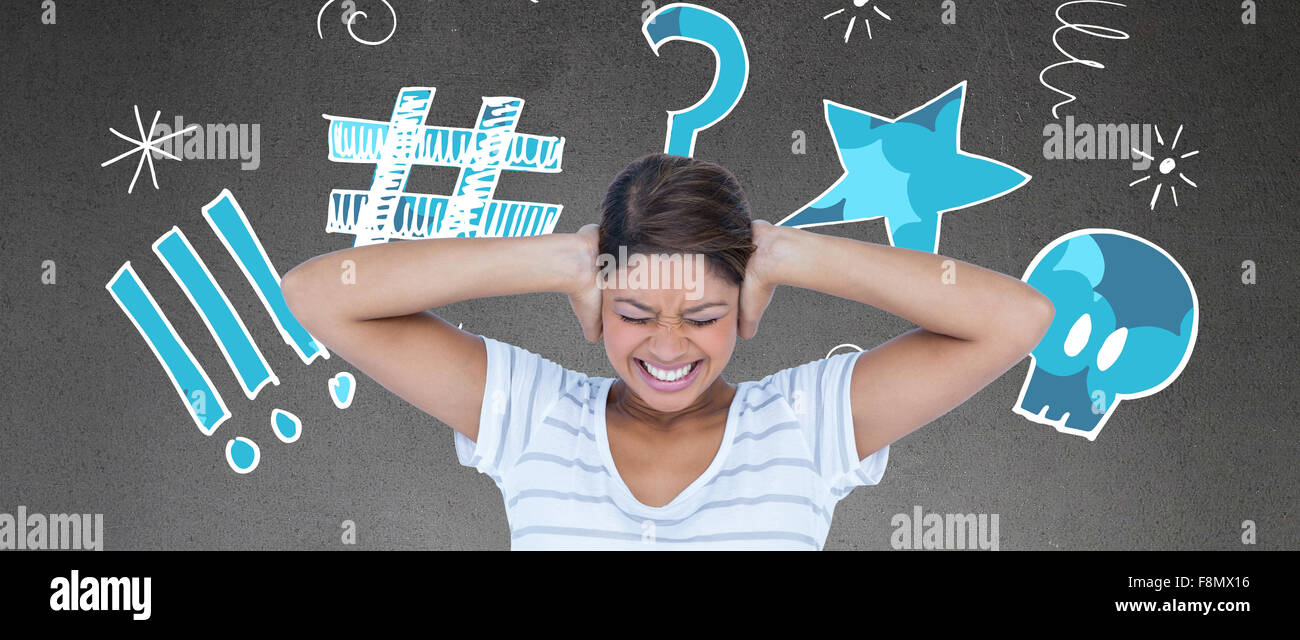 Composite image of angry woman covering ears Stock Photo - Alamy