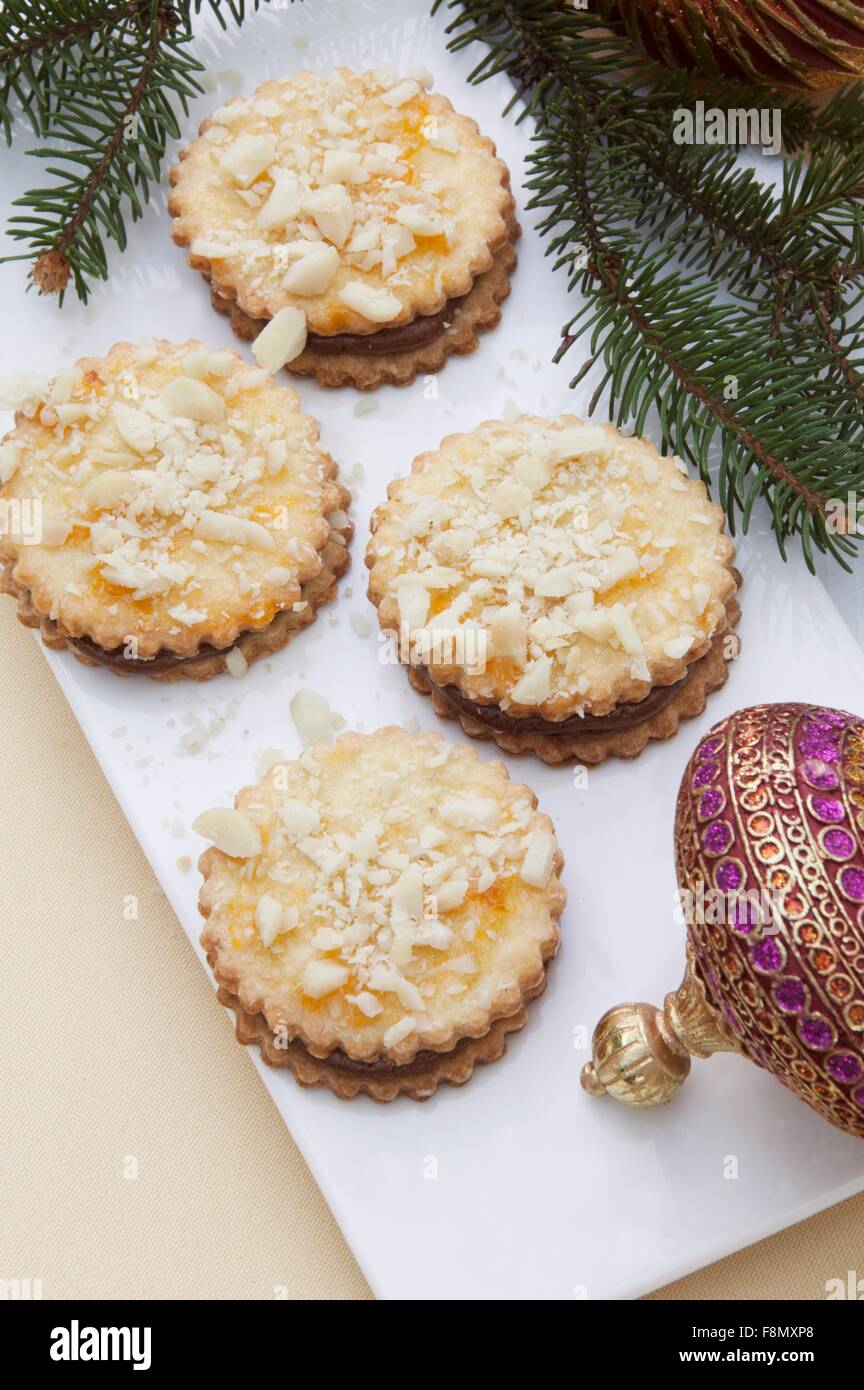 Macadamia biscuits with chocolate filling Stock Photo - Alamy