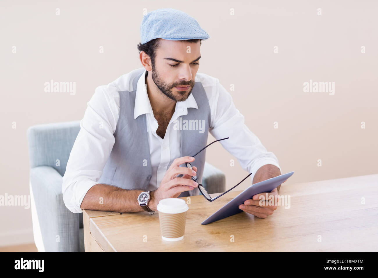 Focused man using tablet Stock Photo - Alamy
