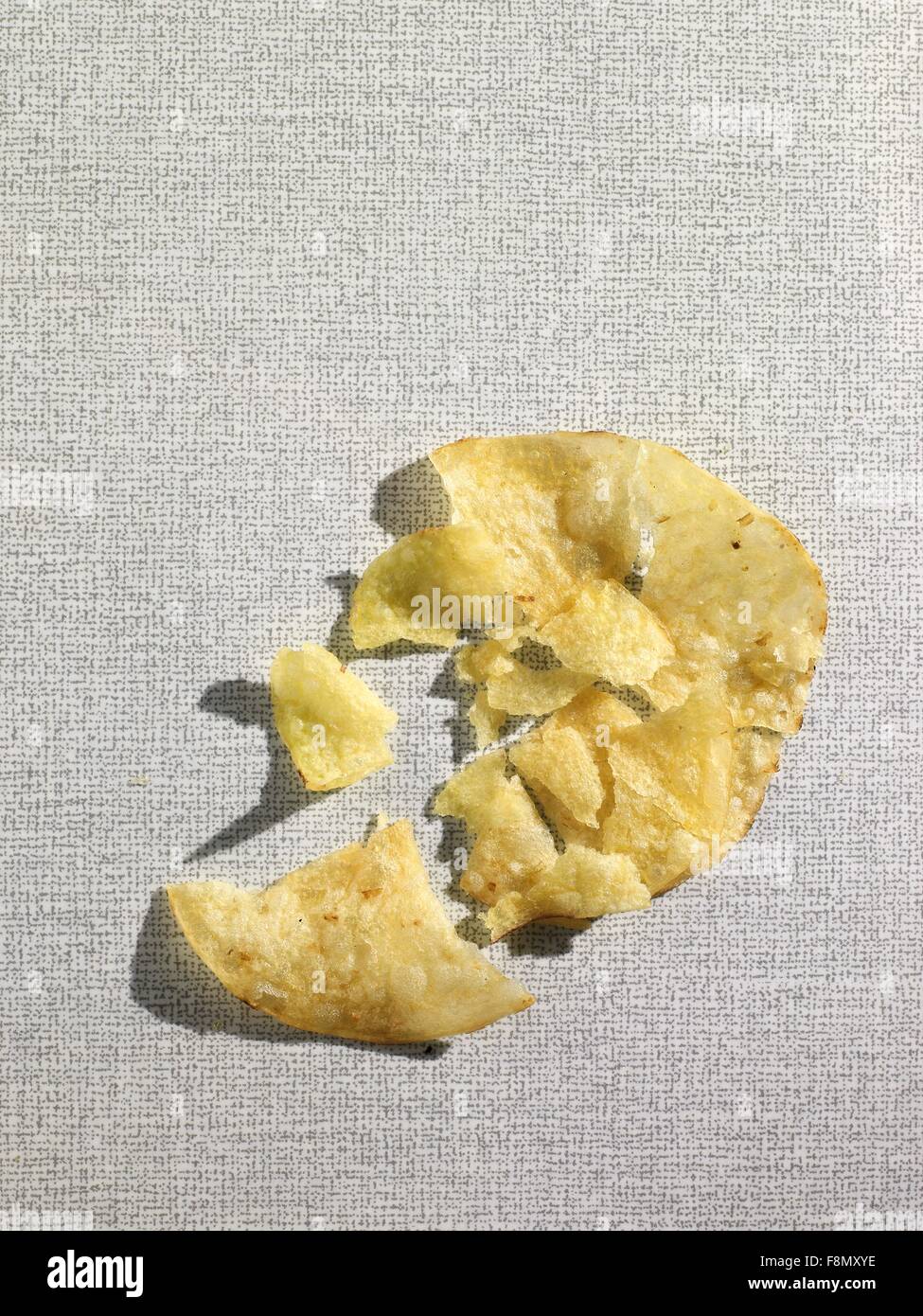 A crushed potato chip (view from above Stock Photo - Alamy