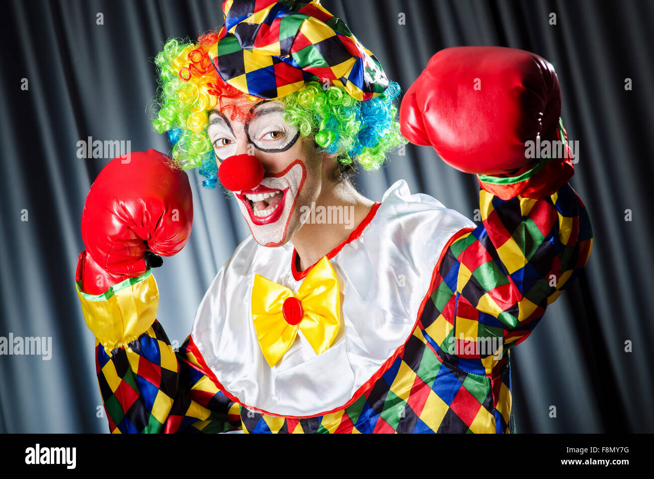 Funny clown in the studio shooting Stock Photo - Alamy