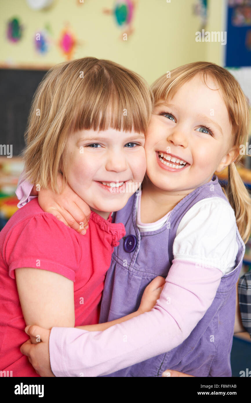 Two Girls Hugging At Pre School Stock Photo - Alamy