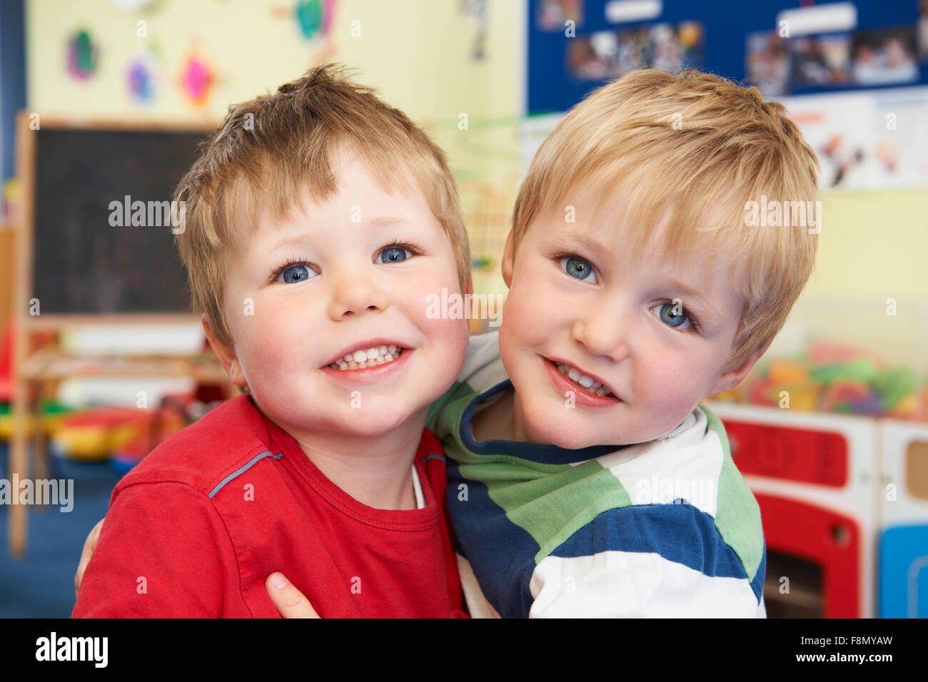 Two Boys Hugging One Another At Pre School Stock Photo - Alamy