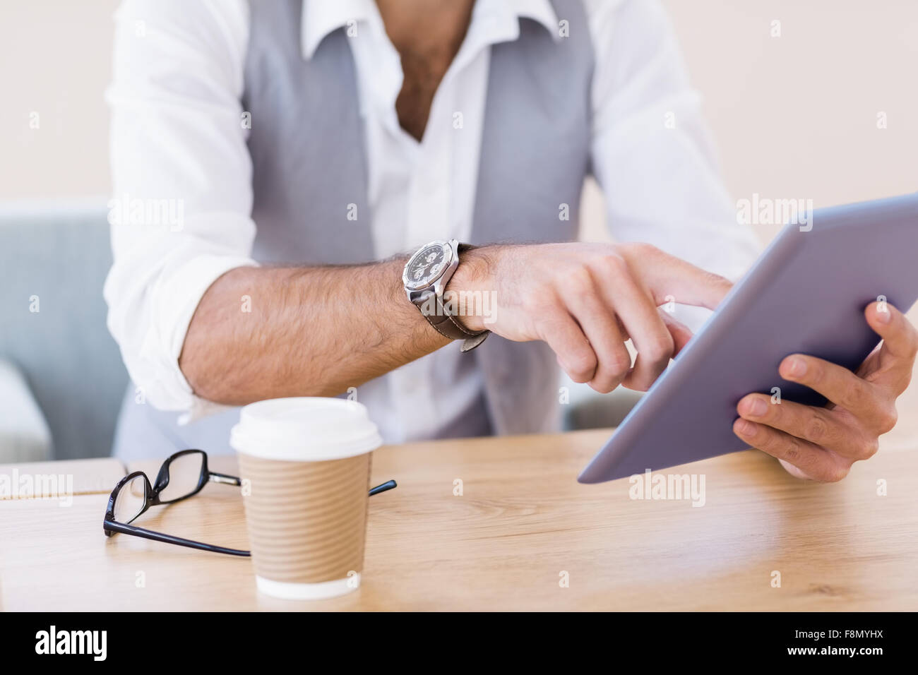 Close up of man using tablet Stock Photo - Alamy