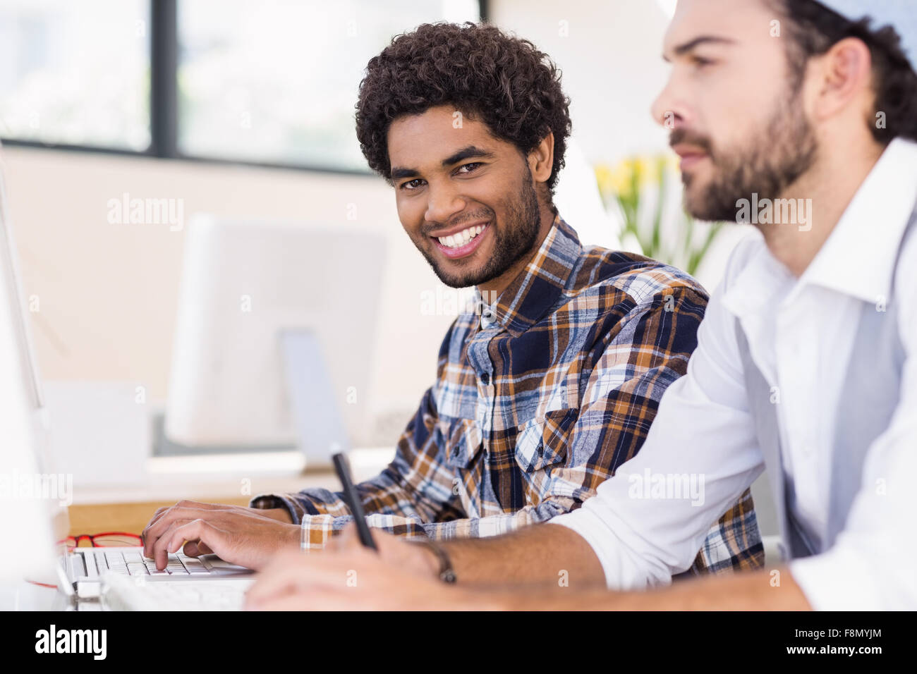 Attractive man posing for camera Stock Photo - Alamy
