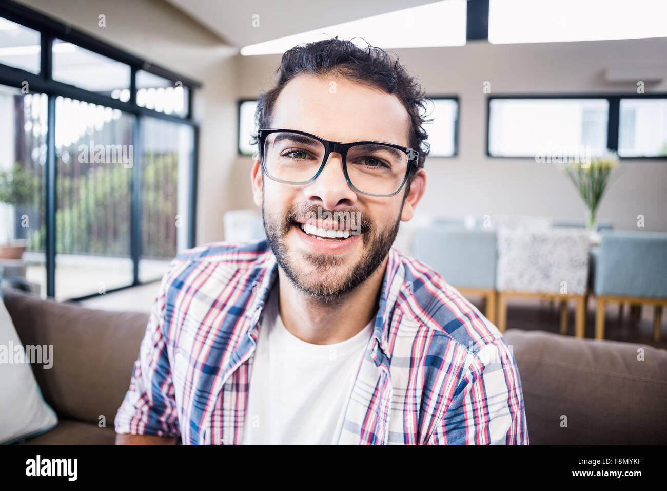 Handsome man smiling at the camera Stock Photo - Alamy