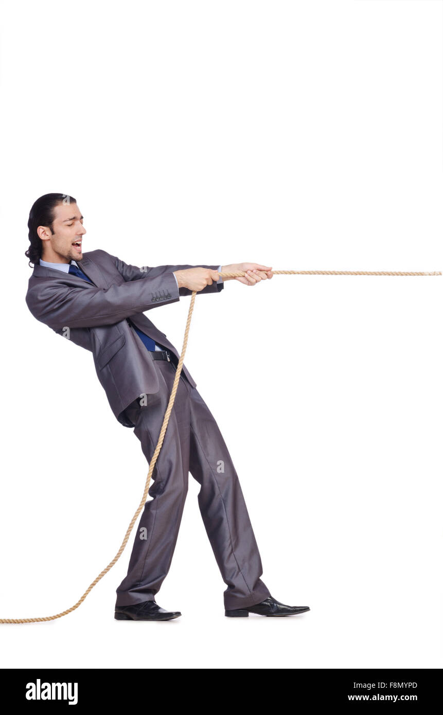 Businessman pulling rope on white Stock Photo - Alamy