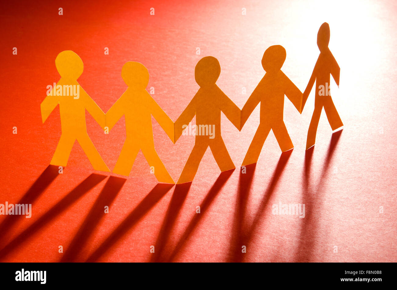 Paper people in teamworking concept Stock Photo - Alamy