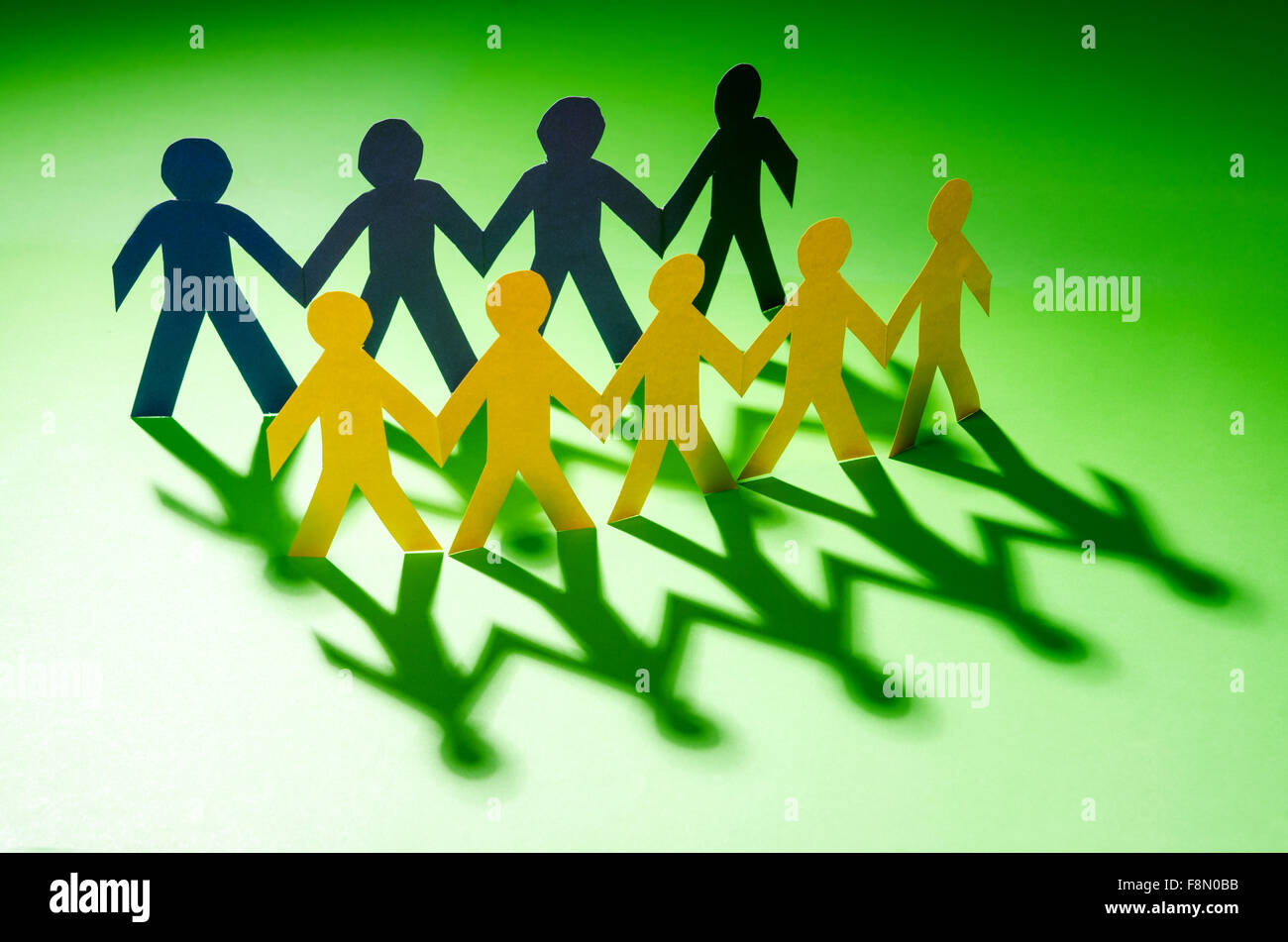 Paper people in teamworking concept Stock Photo - Alamy