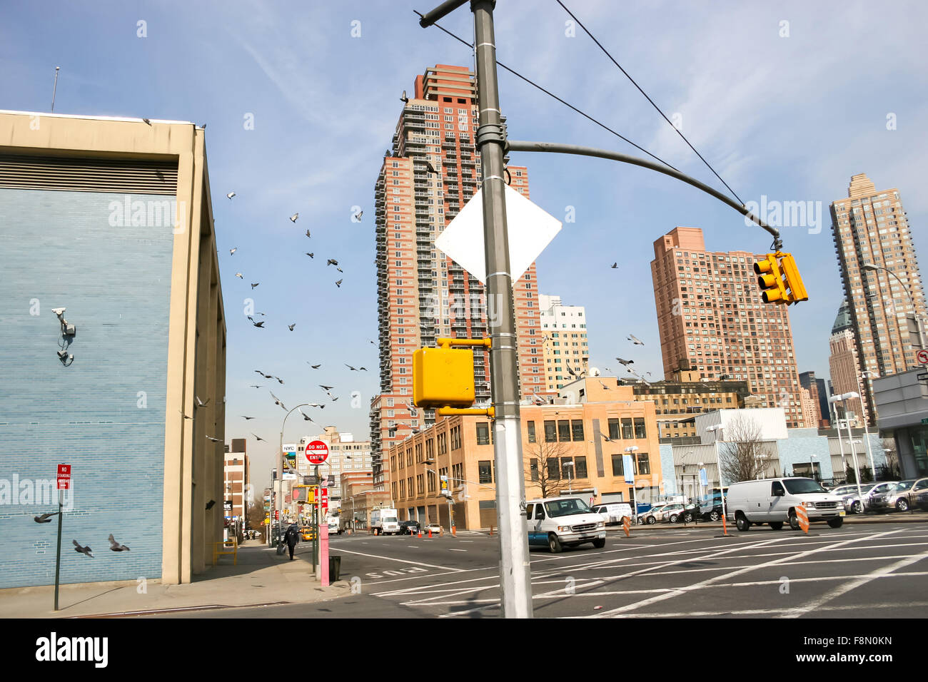 A intersection of 11th Avenue and West 40th street with skyscrapers and ...