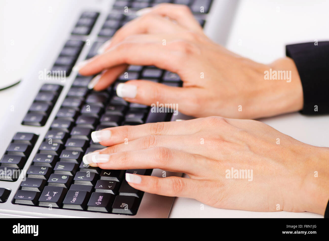 Hands working on the keyboard Stock Photo - Alamy