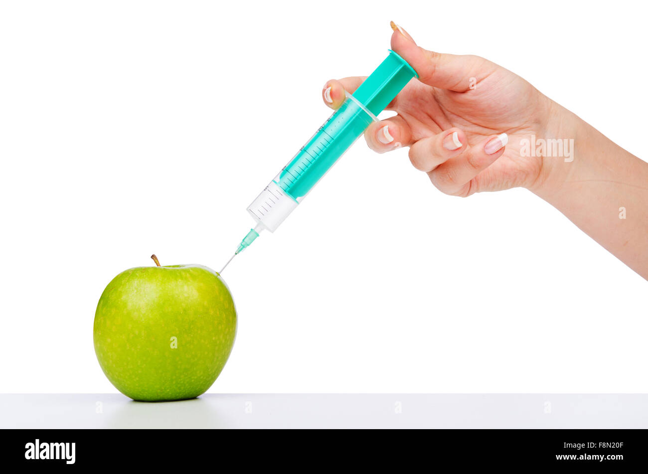 Chemical experiment with apple and syringe Stock Photo - Alamy