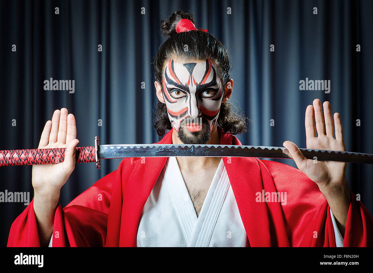 Man with sword and face mask Stock Photo - Alamy