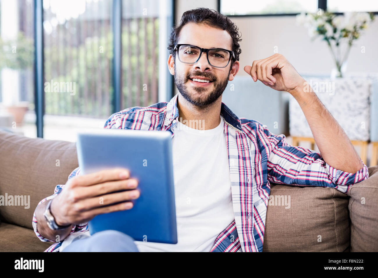 Smiling man glasses tablet computer hi-res stock photography and images ...