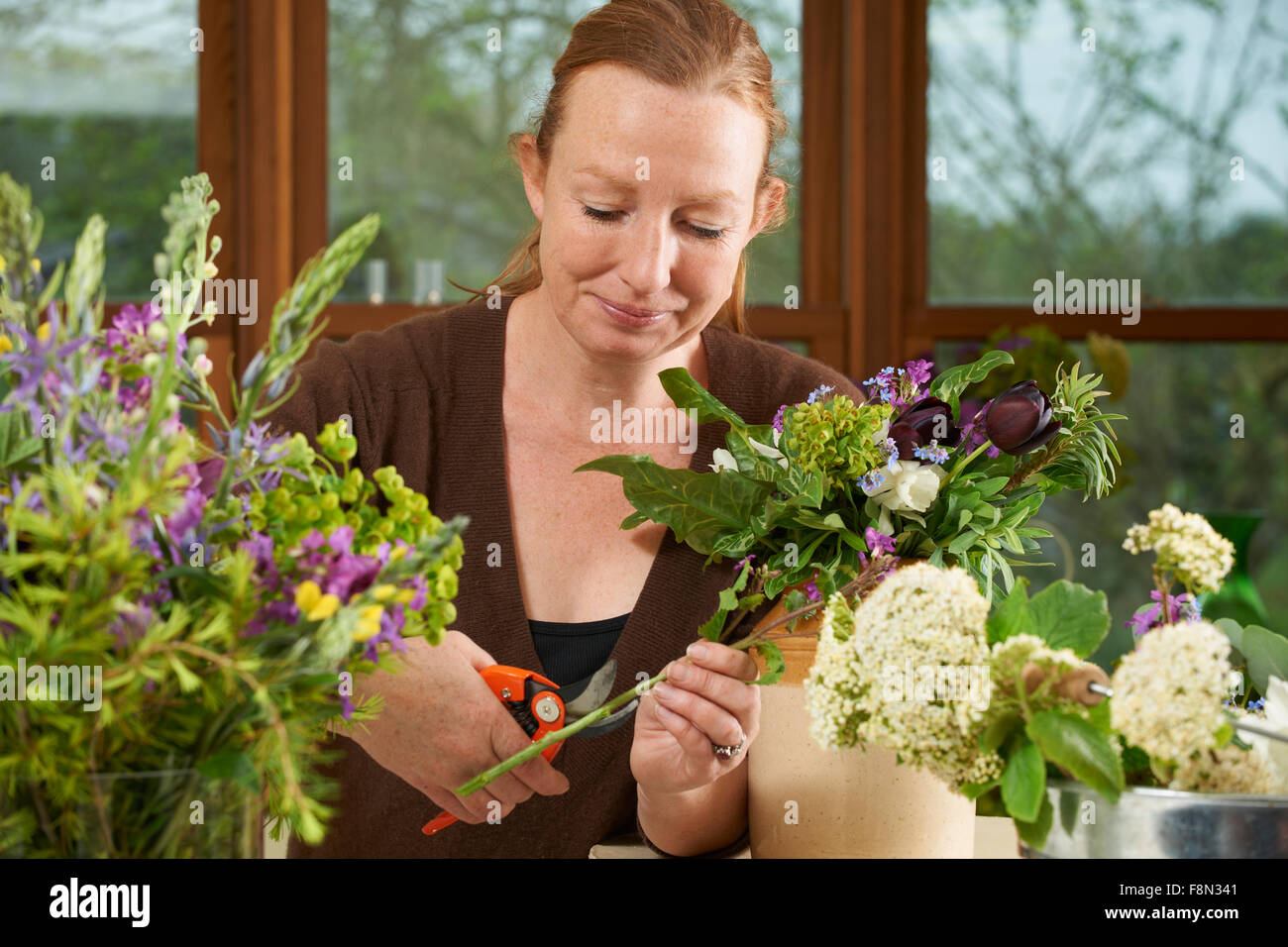 Florist Working On Arrangement In Flower Shop Stock Photo - Alamy