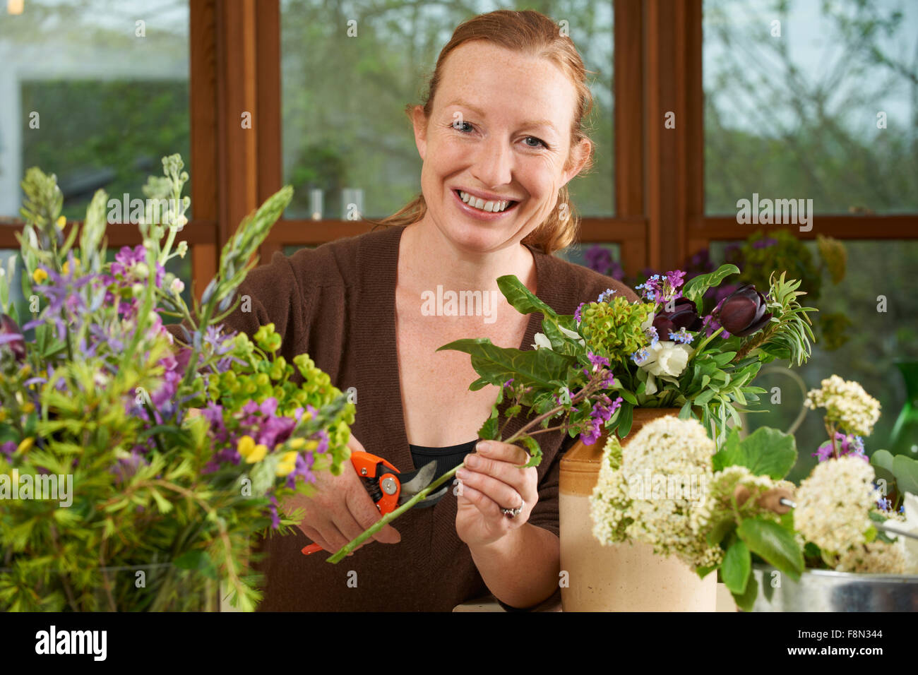 Florist Working On Arrangement In Flower Shop Stock Photo - Alamy